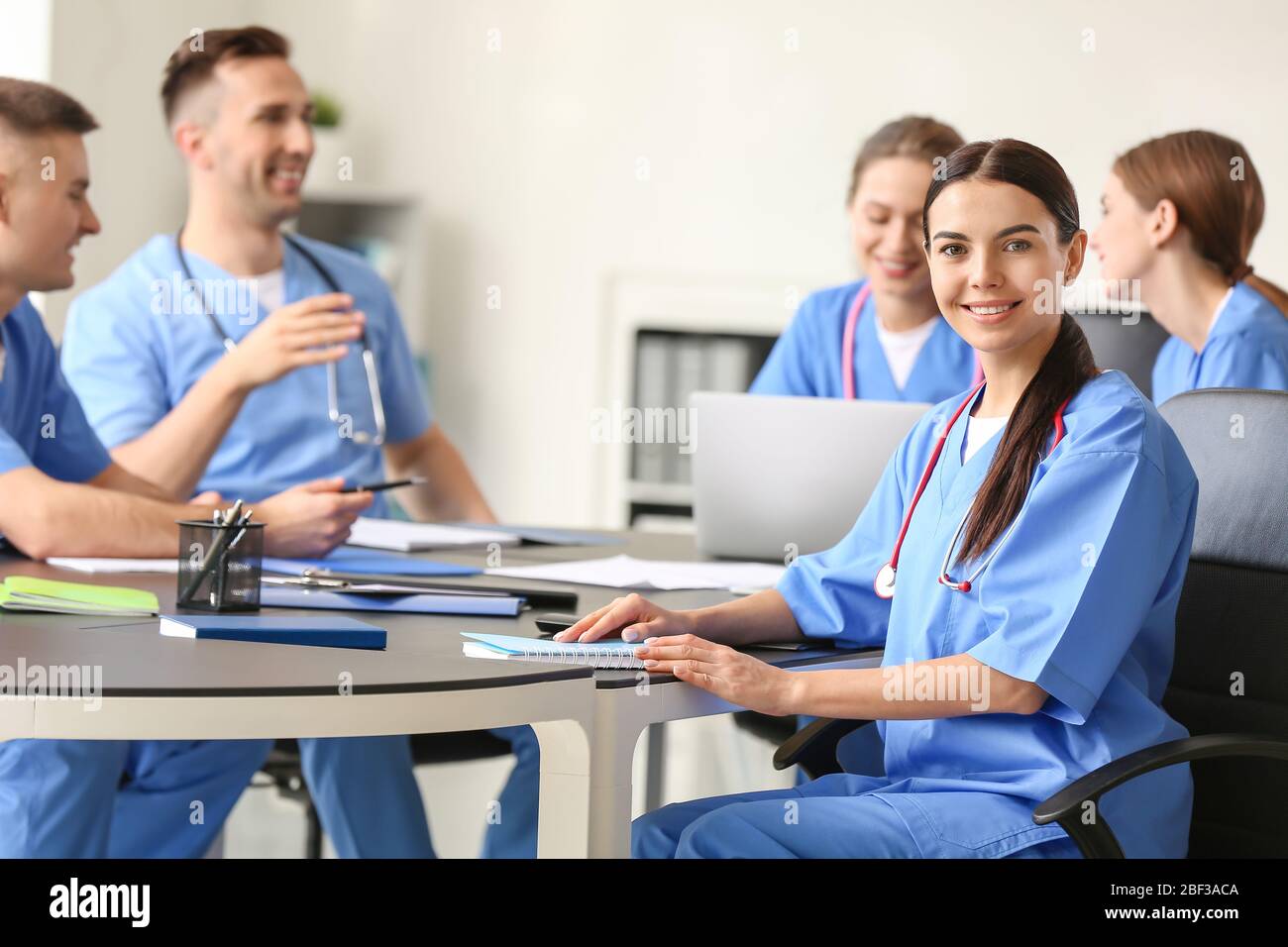 Female medical student with group at medical university Stock Photo - Alamy
