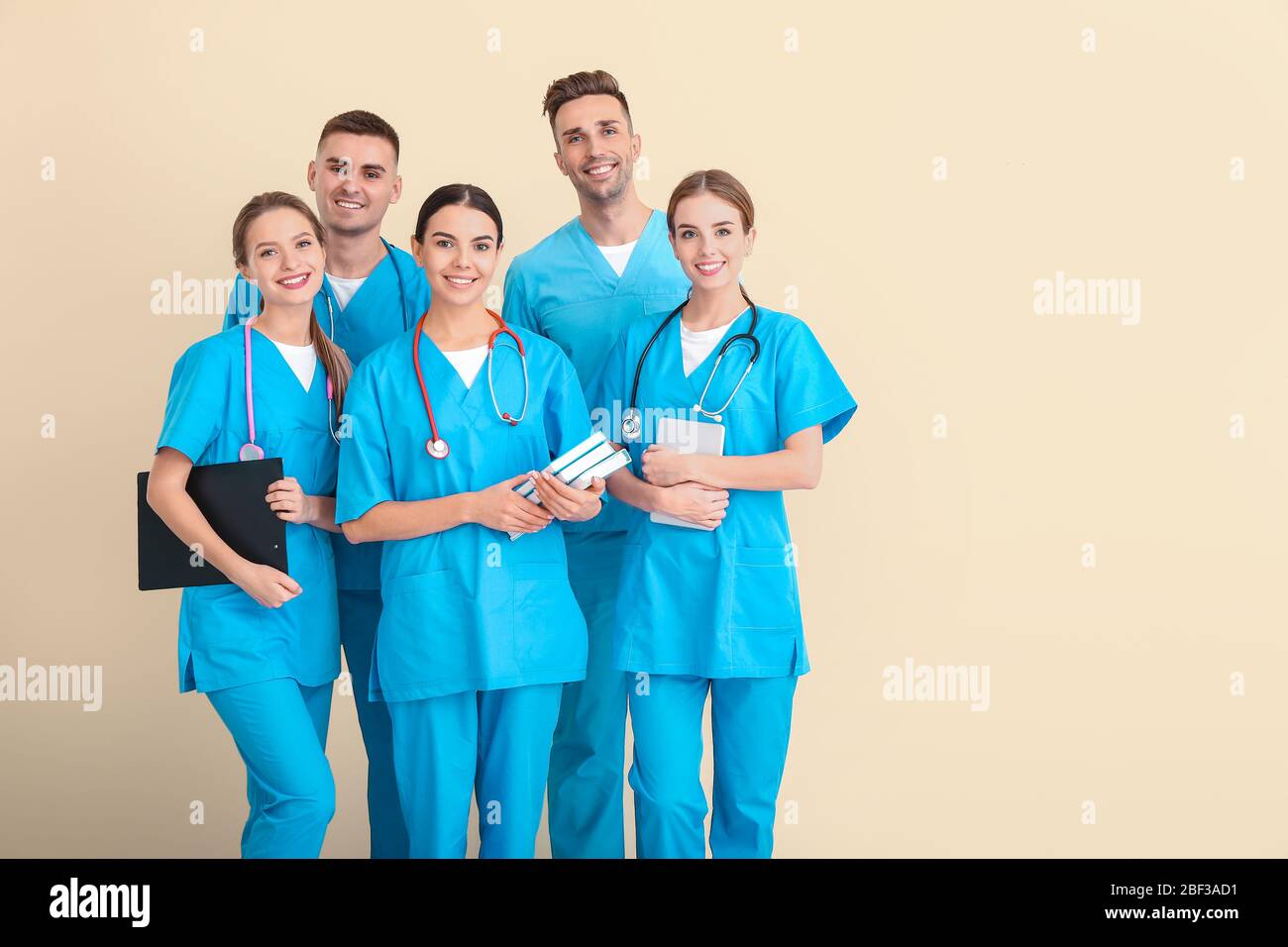 Group of medical students on light background Stock Photo - Alamy