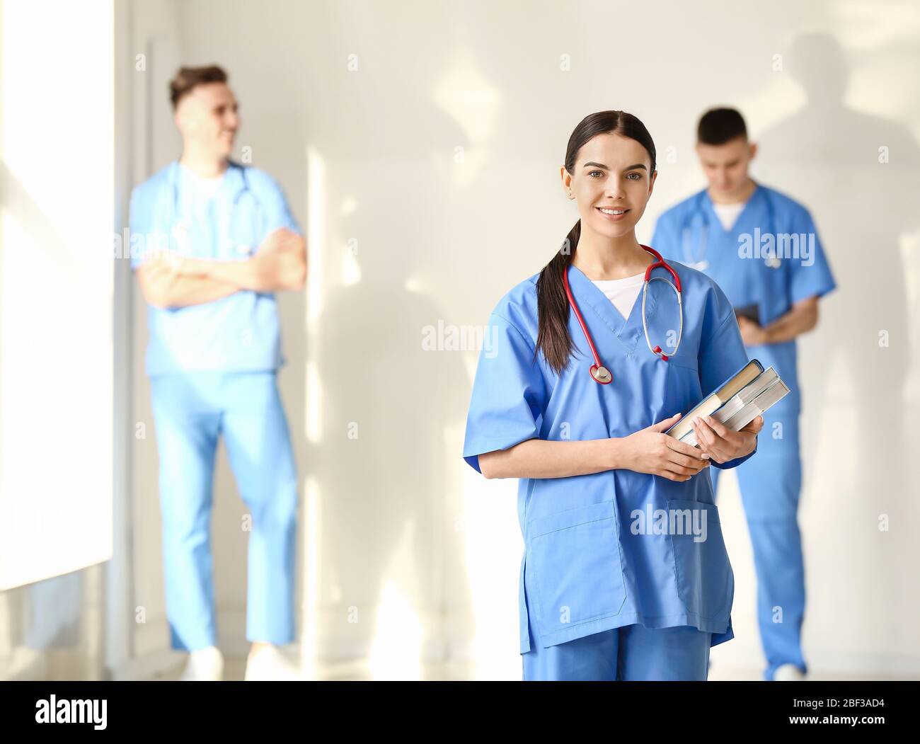 Female medical student in hall of clinic Stock Photo - Alamy