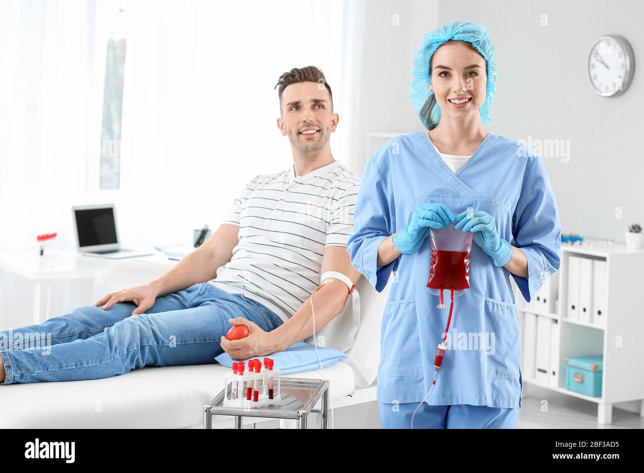 Man donating blood in hospital Stock Photo - Alamy