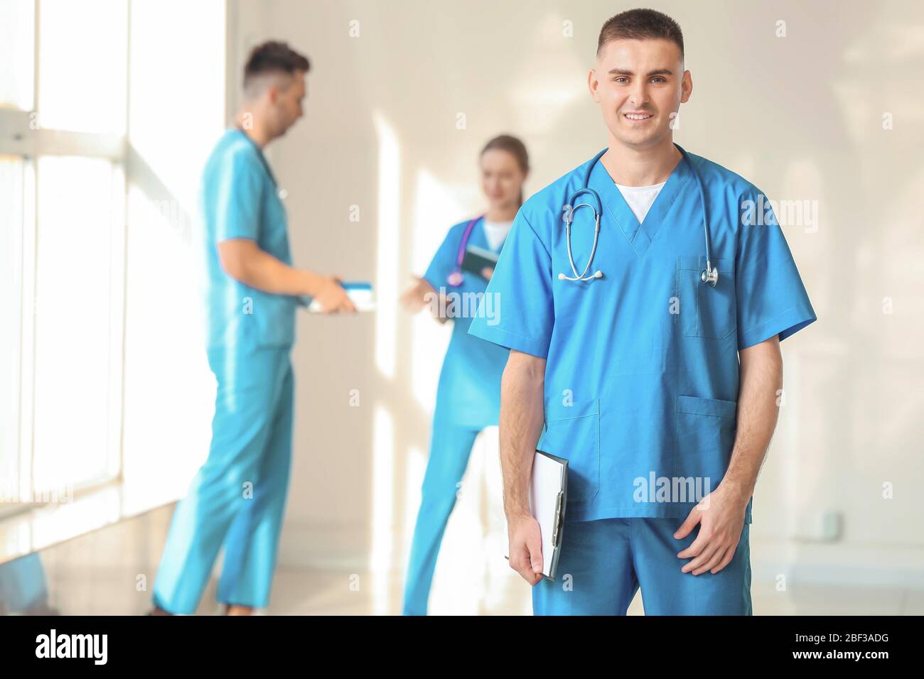 Male medical student in hall of clinic Stock Photo - Alamy
