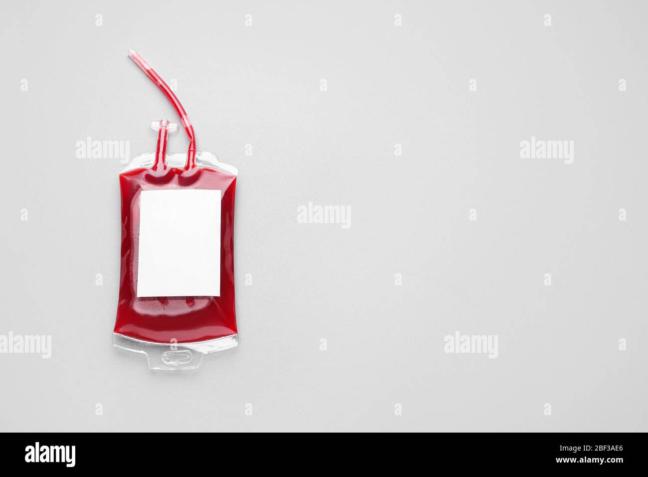 Blood pack for transfusion on grey background Stock Photo - Alamy
