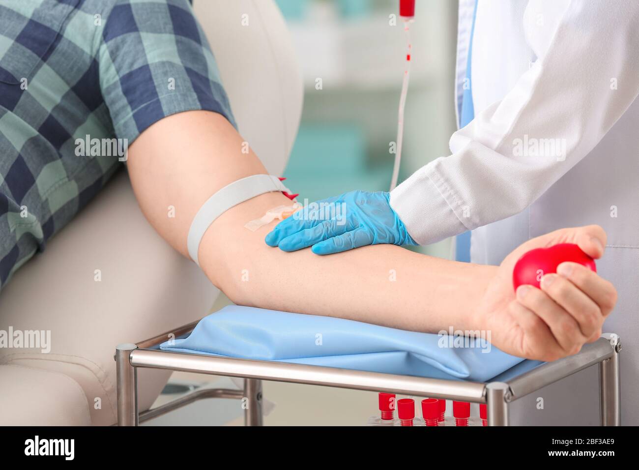 Man donating blood in hospital Stock Photo - Alamy