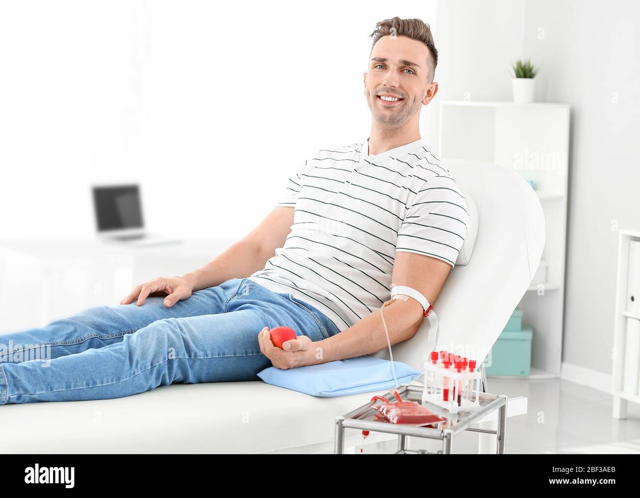 Man donating blood in hospital Stock Photo - Alamy