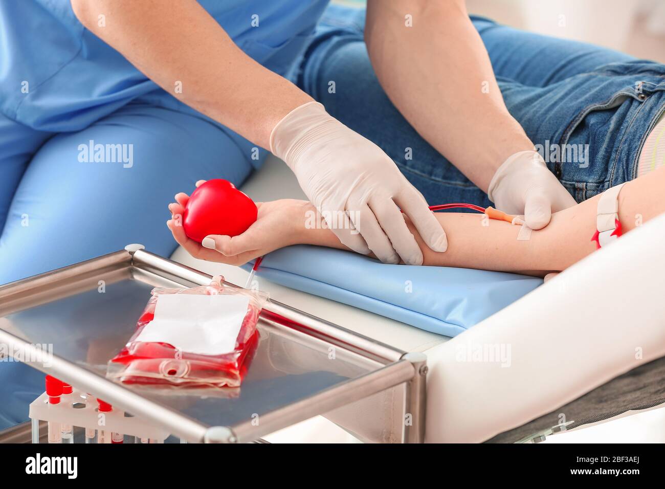 Woman donating blood in hospital Stock Photo - Alamy