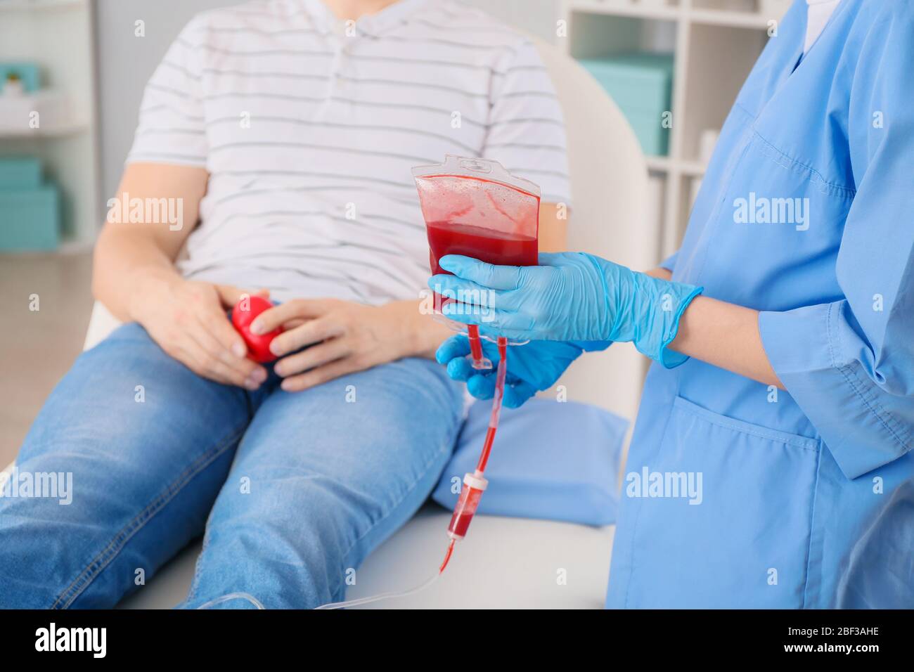 Man donating blood in hospital Stock Photo - Alamy