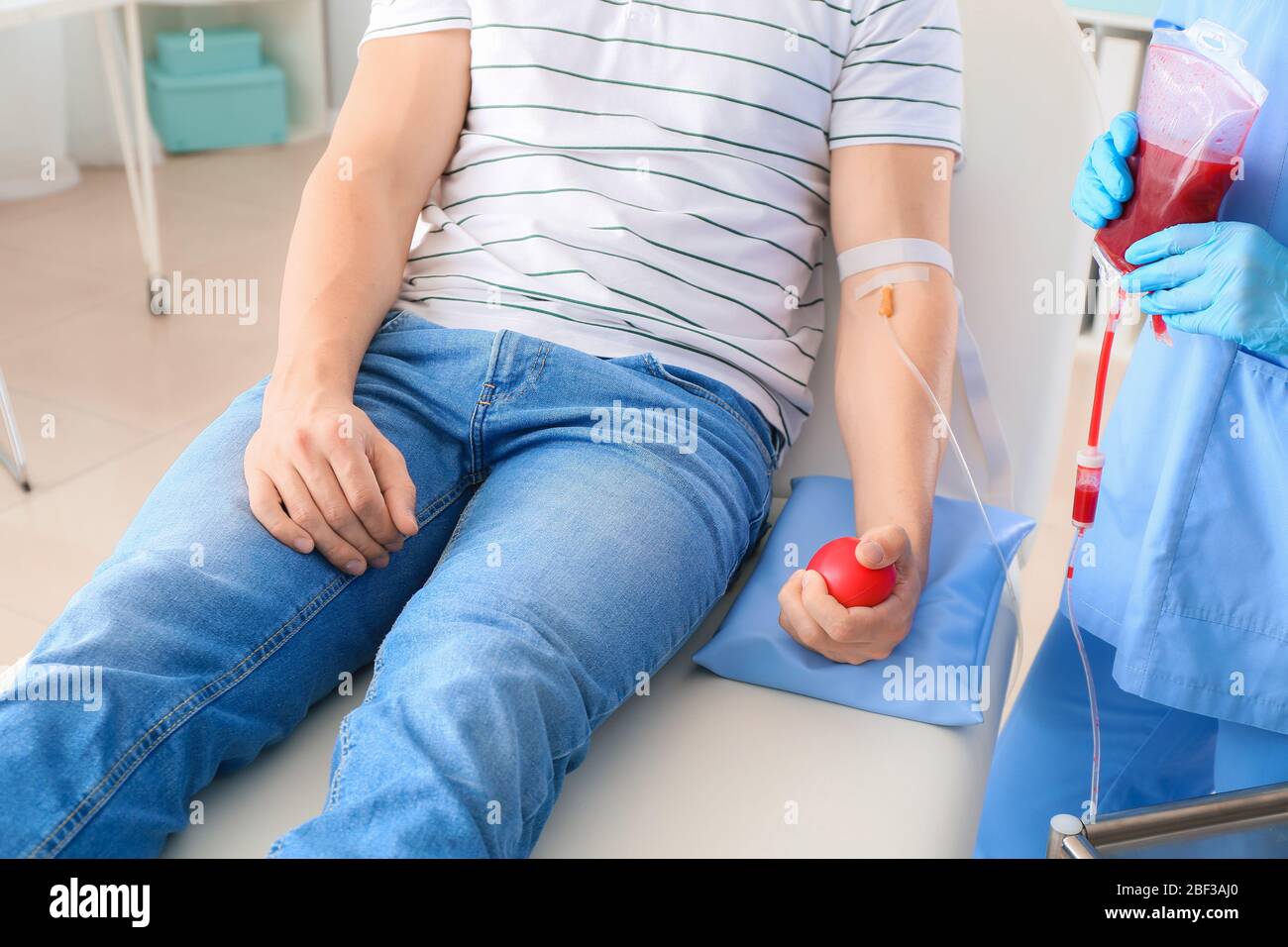 Man donating blood in hospital Stock Photo - Alamy