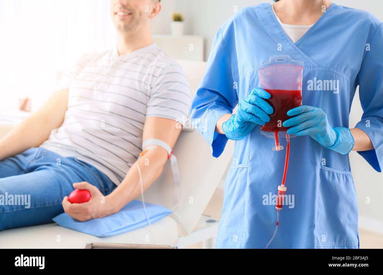 Young person donating blood hi-res stock photography and images - Alamy