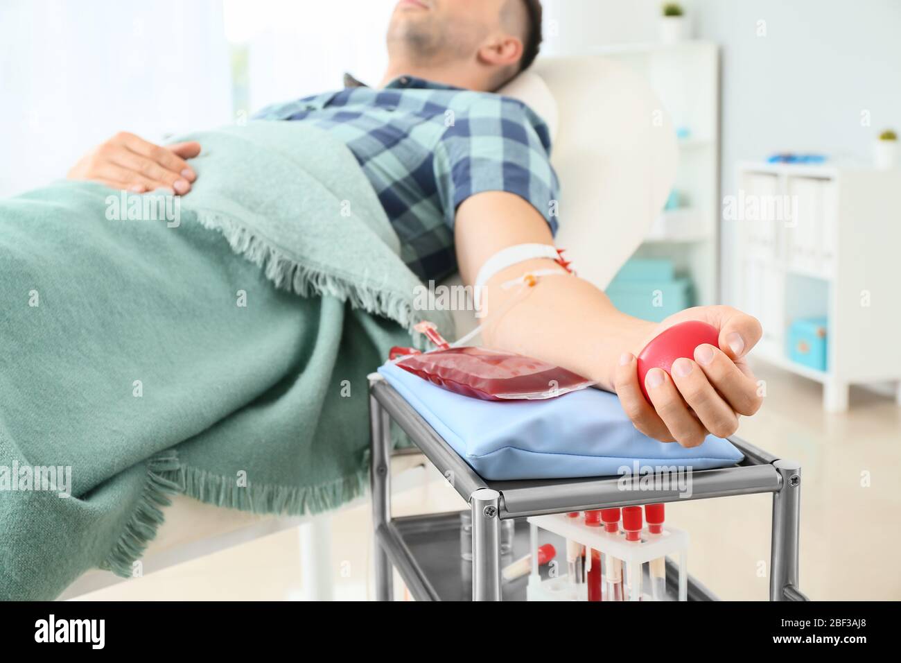Man donating blood in hospital Stock Photo - Alamy