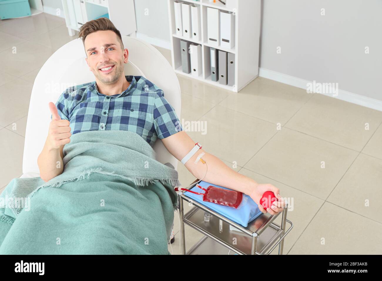 Man donating blood in hospital Stock Photo - Alamy