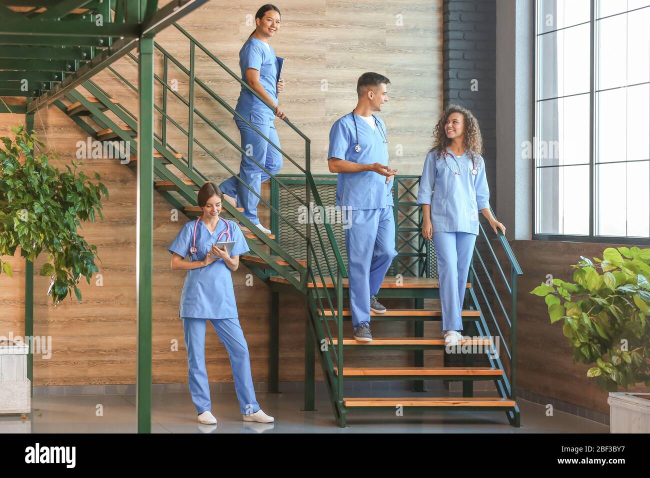 Group of medical students in corridor of modern clinic Stock Photo - Alamy