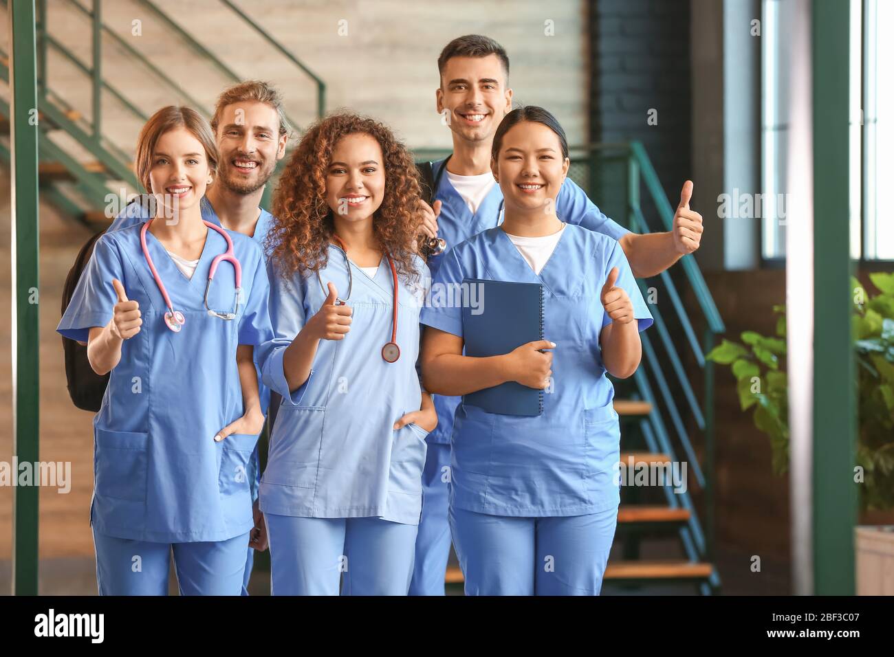 Group of medical students in corridor of modern clinic Stock Photo - Alamy