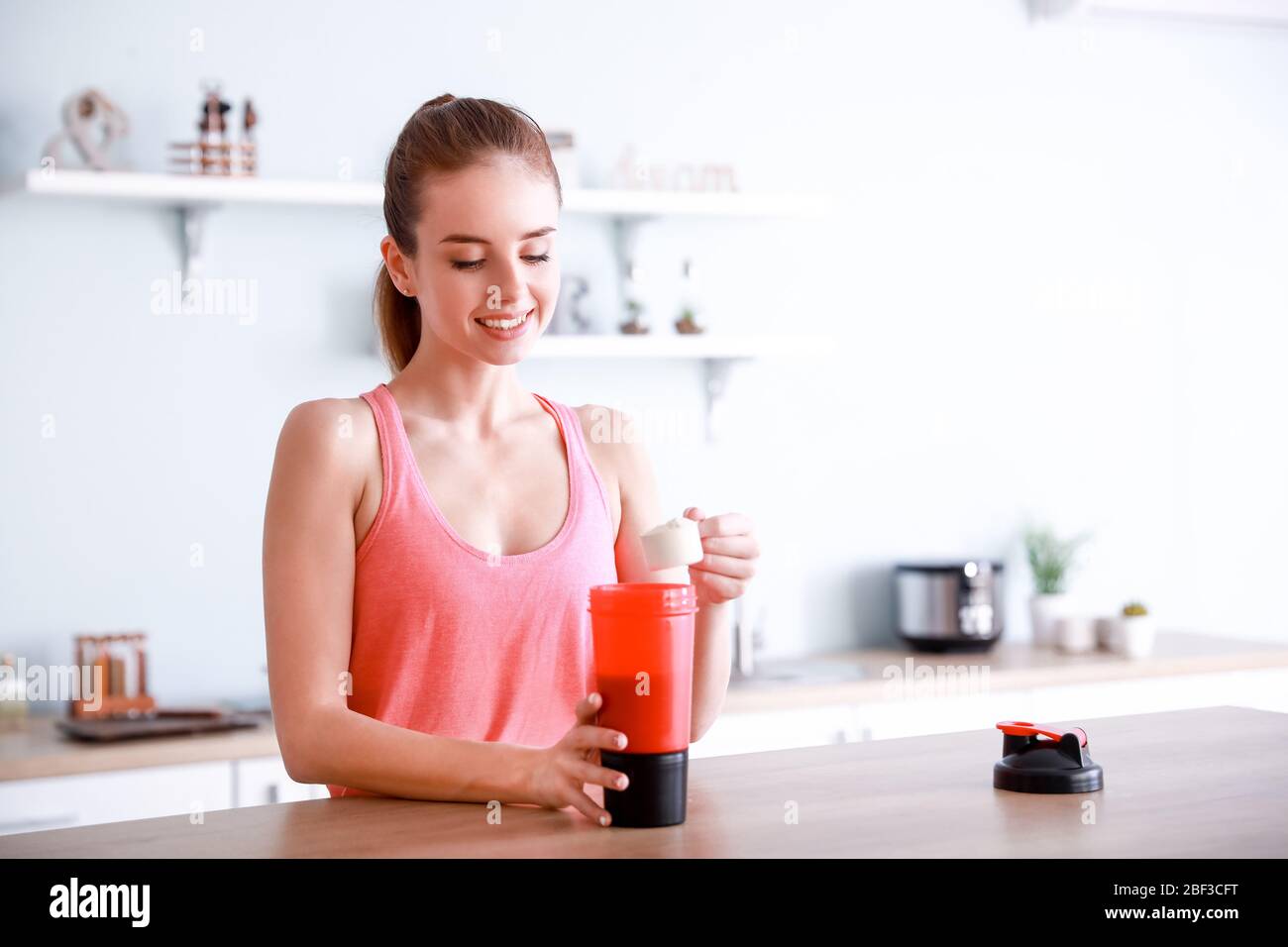 Woman making protein shake hi-res stock photography and images - Alamy