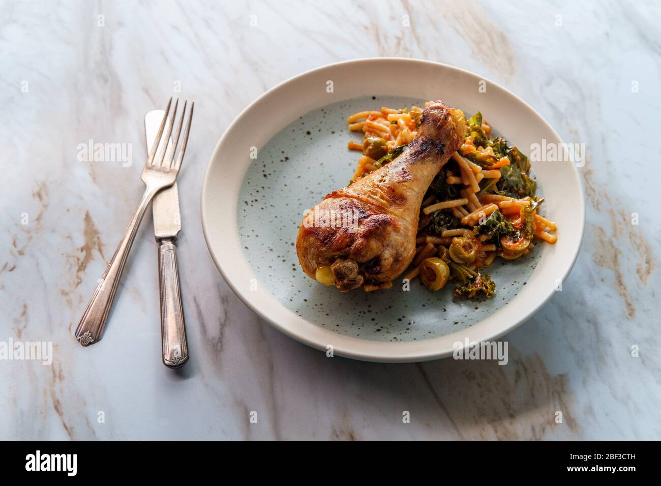 Spanish fideo con pollo chicken legs with vermicelli green olives and ...