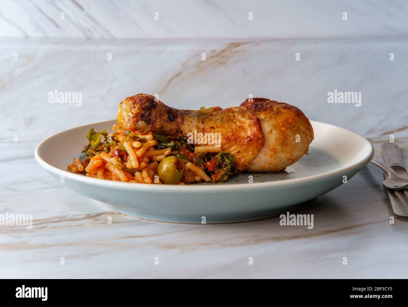 Spanish fideo con pollo chicken legs with vermicelli green olives and ...