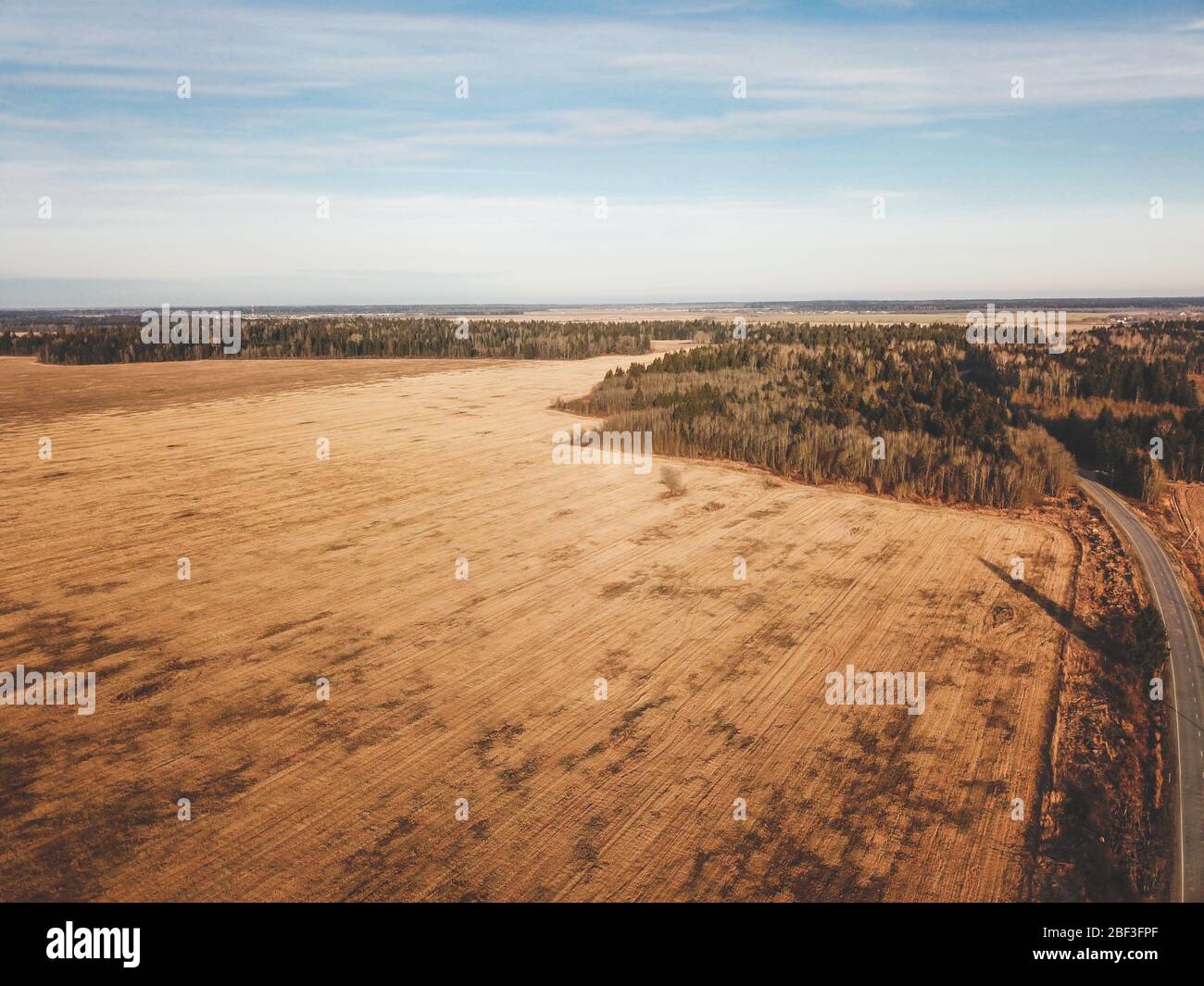 Road and agricultural fields aerial view. wide meadow landscape with ...