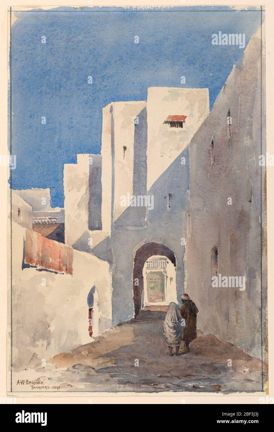 Tangiers. A narrow walled area leading to an archway in the background ...