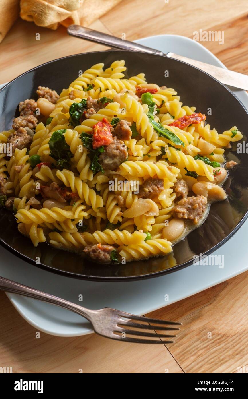 Italian kale sausage rotini pasta in white wine butter garlic sauce ...