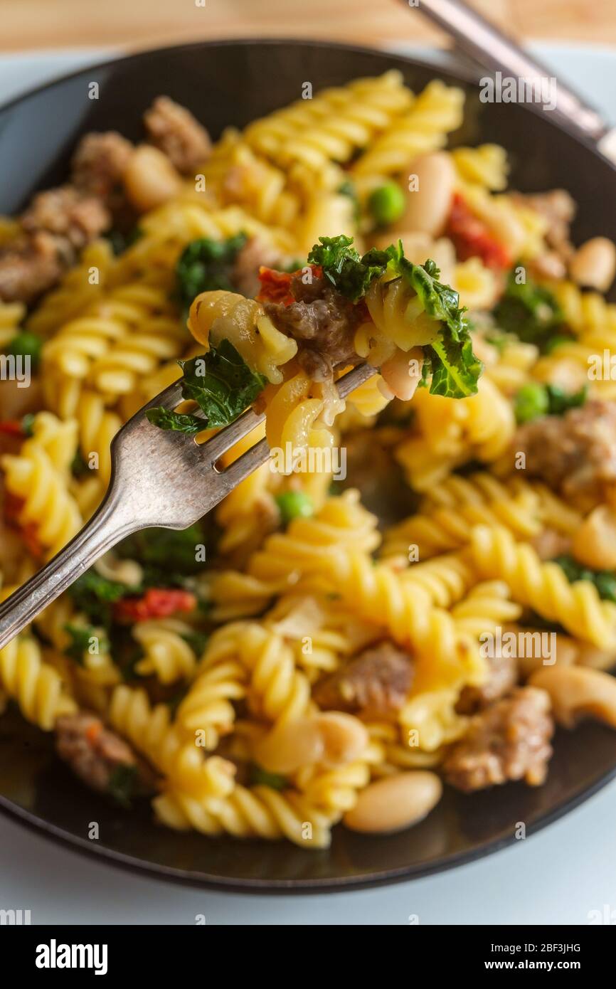 Italian kale sausage rotini pasta in white wine butter garlic sauce ...