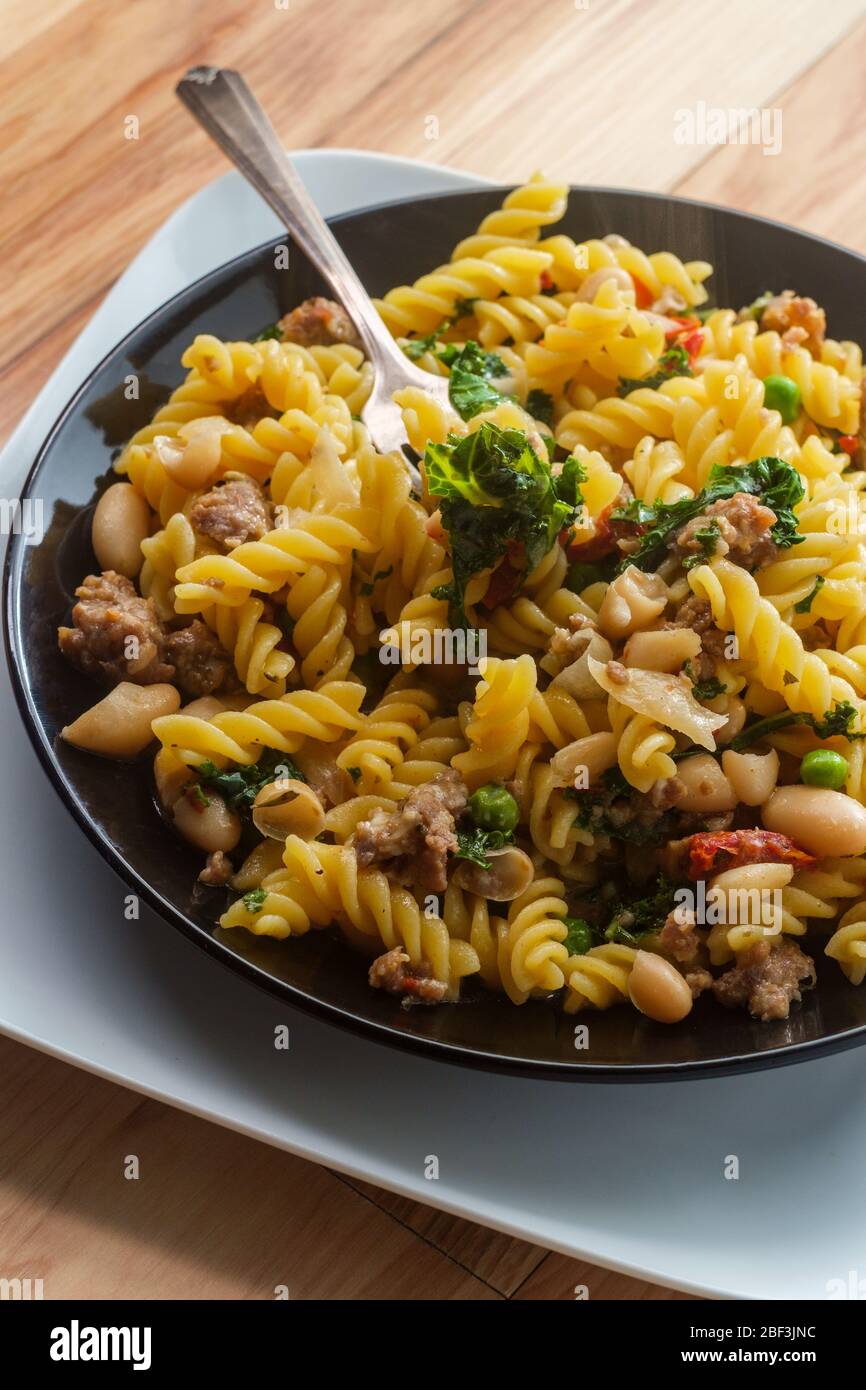 Italian kale sausage rotini pasta in white wine butter garlic sauce ...