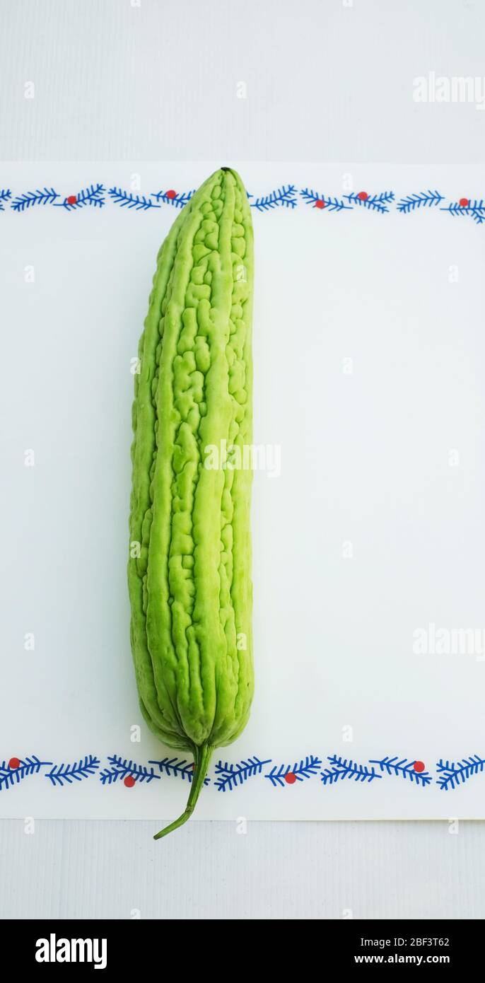 Bitter melon fruit on white background Stock Photo - Alamy