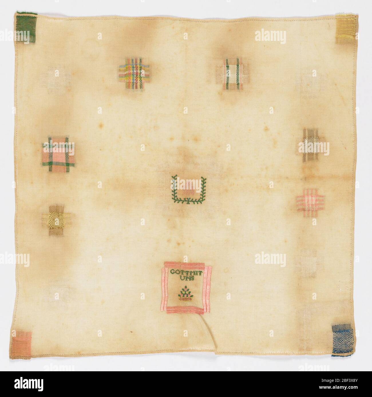 Darning sampler. Ten squares of darning pattern, four patched corners ...