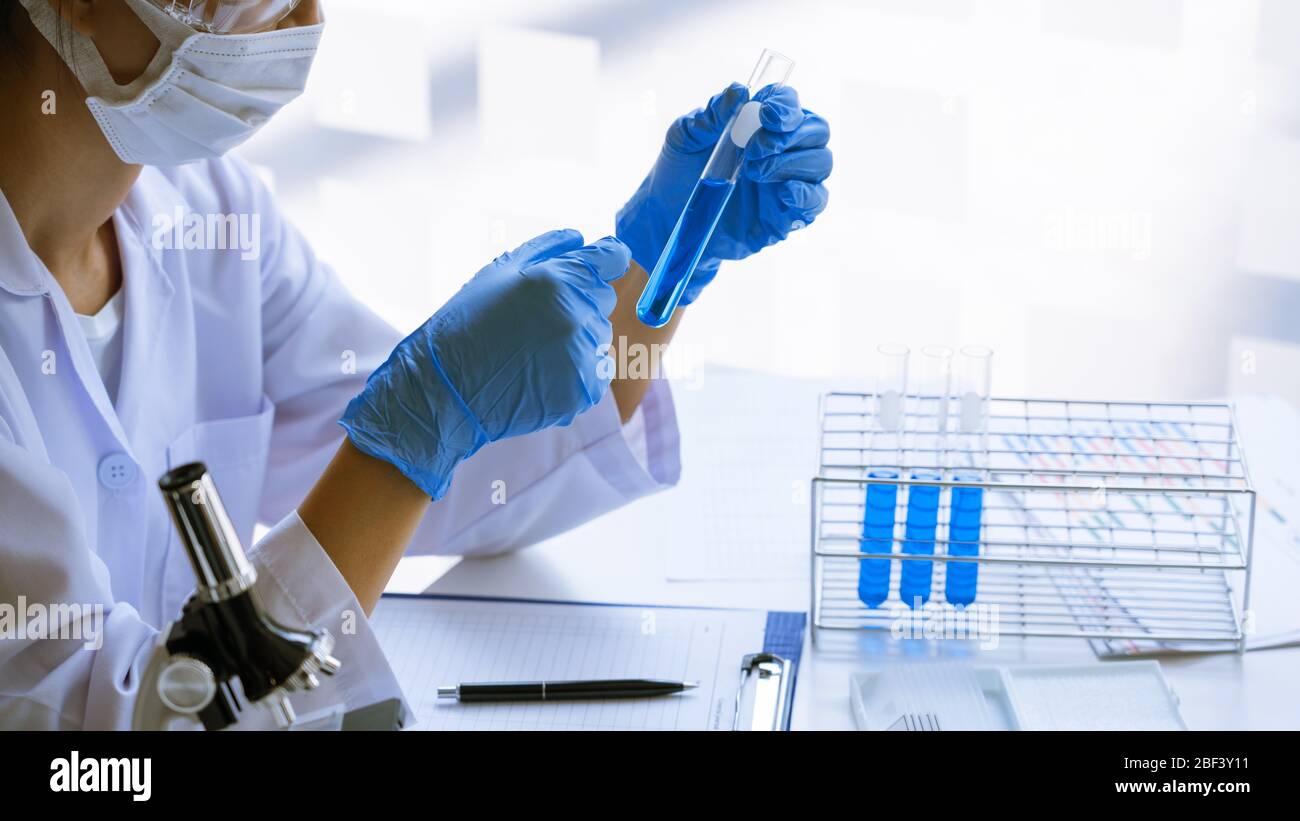 Scientist wear lab coat and protective wear are working with research ...