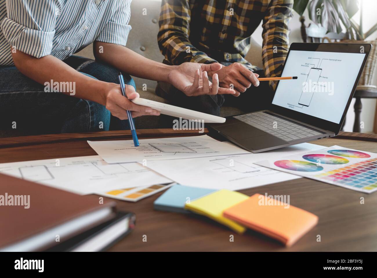 Creative team analyzing prototype products for product design in ...