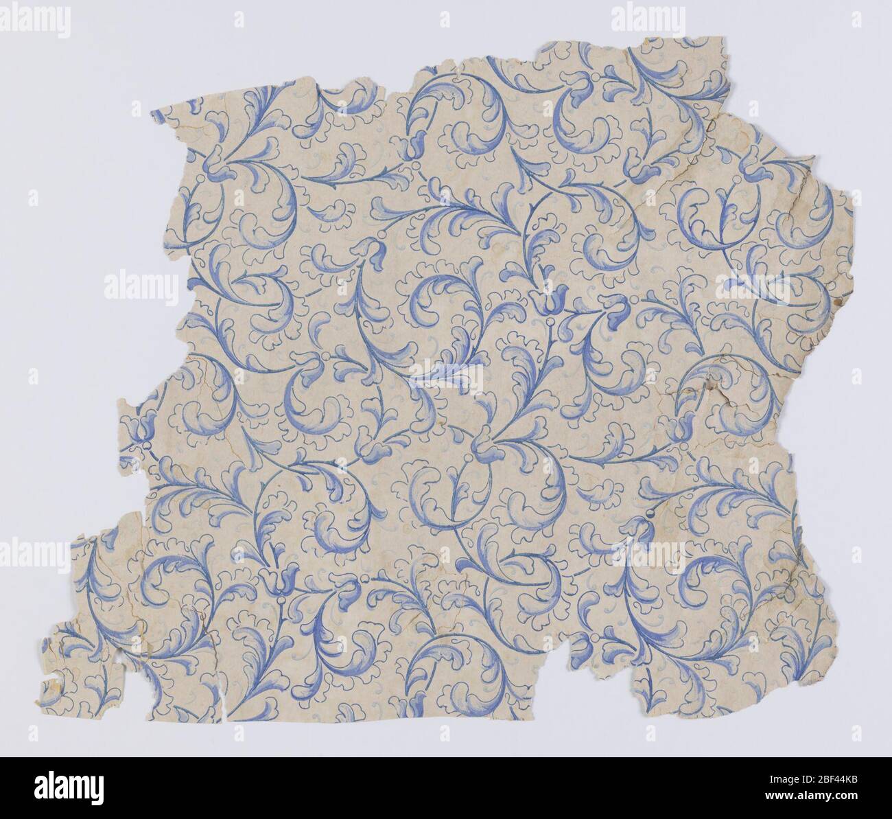 Sidewall. All-over pattern of blue scrolling leaves. Printed in three ...
