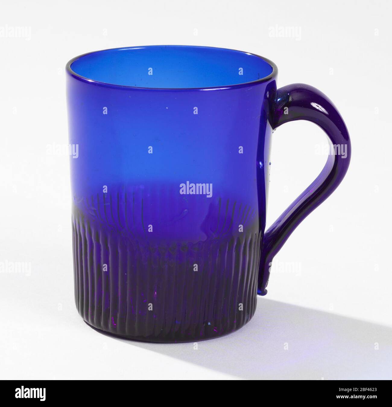 Mug. Cobalt blue glass Stock Photo - Alamy
