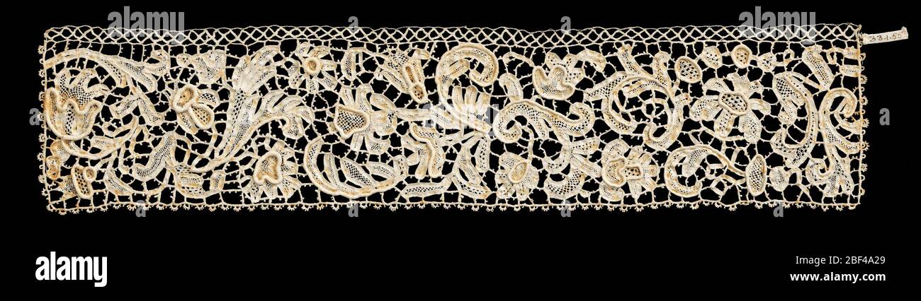 Fragment. Leaf scrolls and floral forms in tape outline with details in ...