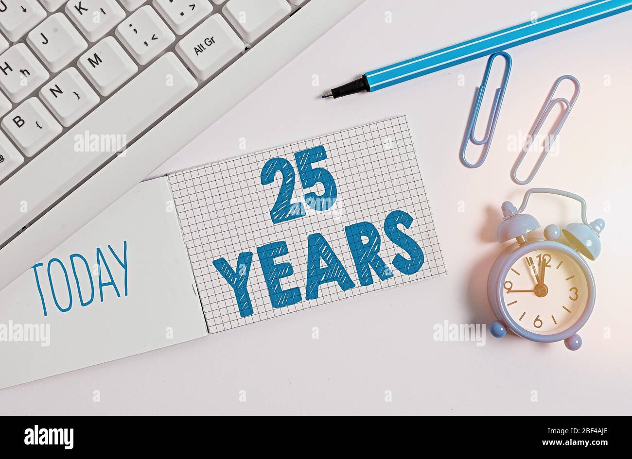 Writing note showing 25 Years. Business concept for Remembering or ...