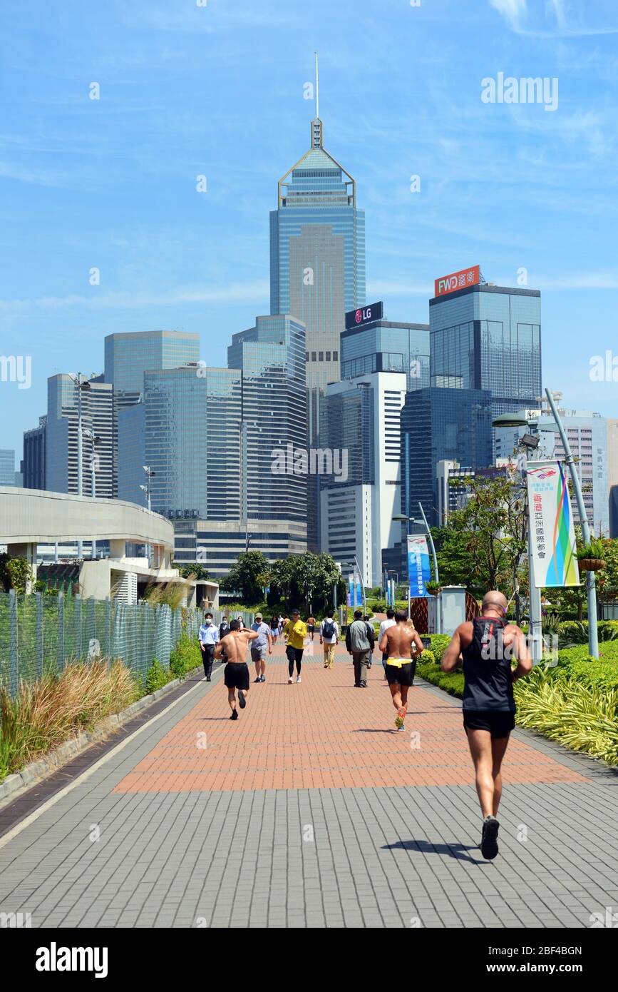 Jogging through Tamar park in Admiralty, Hong Kong Stock Photo - Alamy