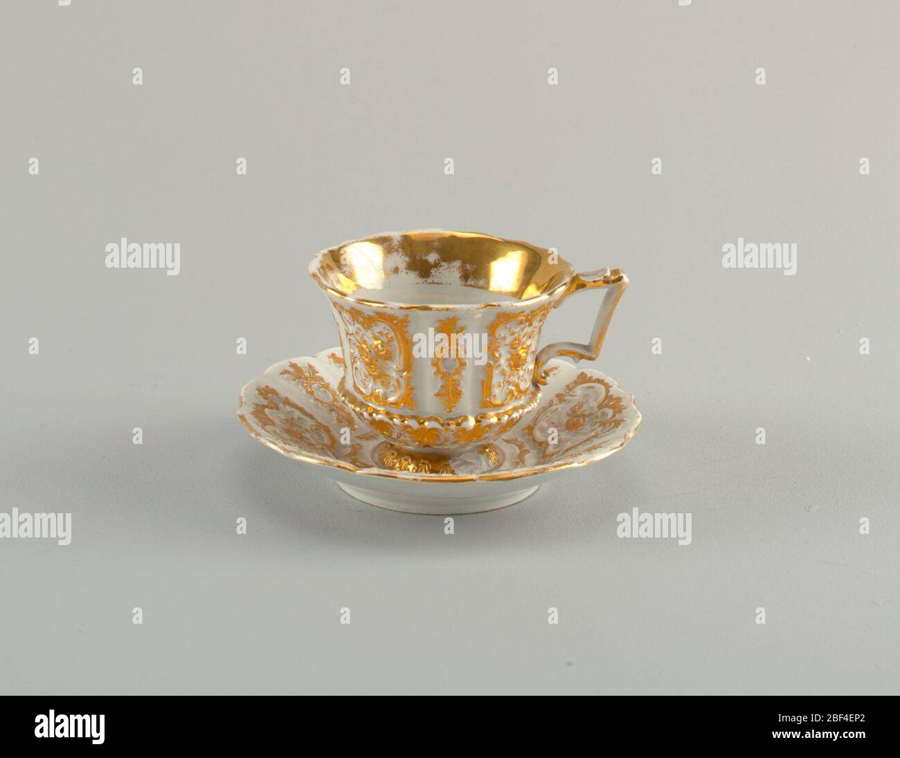Cup and Saucer with Molded Pattern. Cup with rounded foot and round ...
