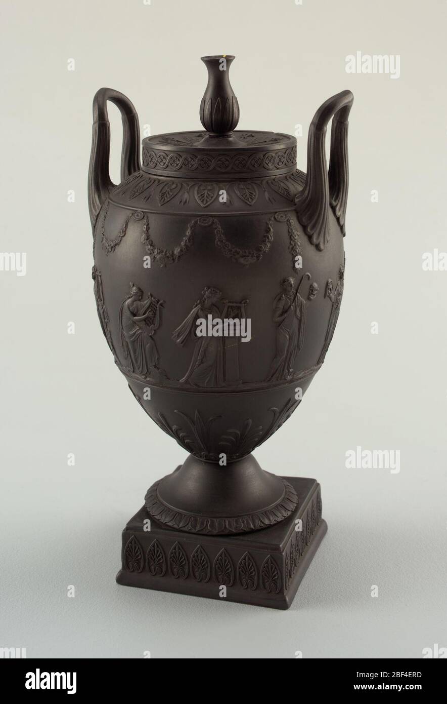 Urn. Ovoid, with high looped handles and small cylindrical neck. On ...