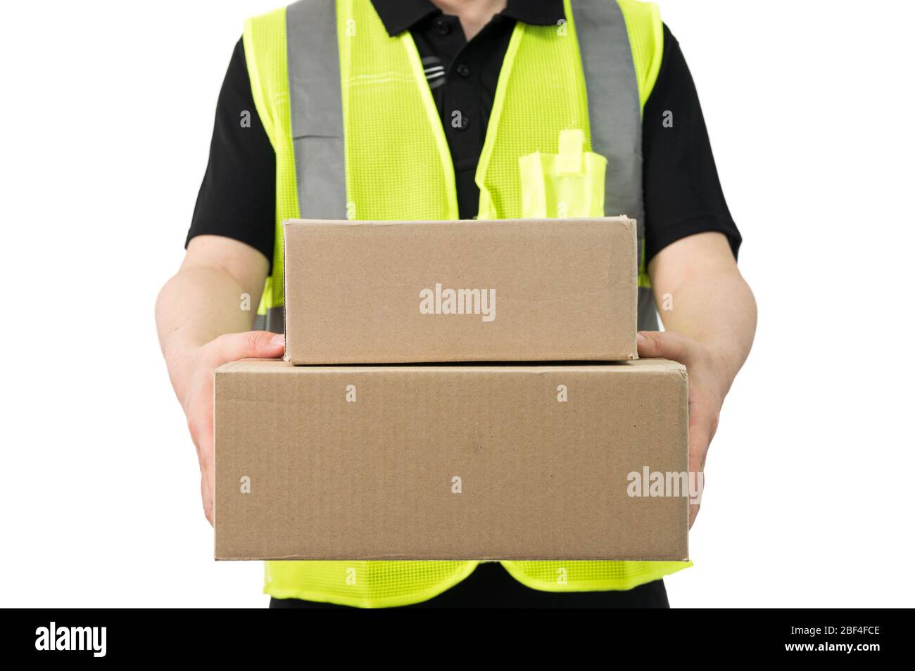 delivery man holding a big parcel isolated on white background Stock ...