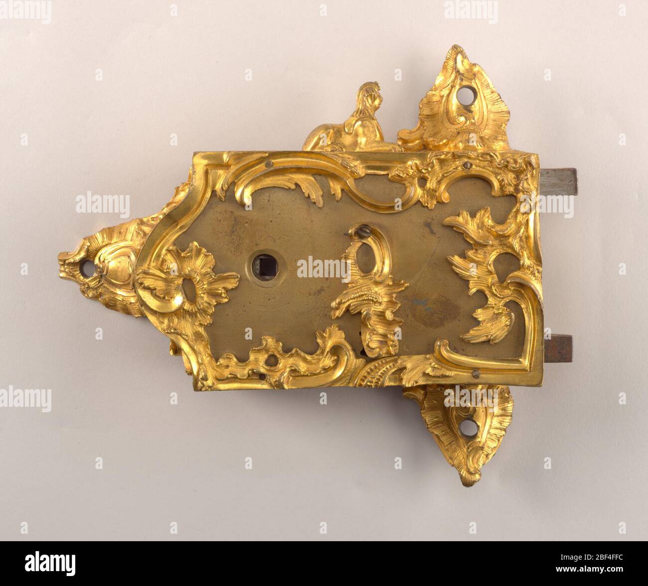 Lock. Rectangular brass lock box overlaid with chiselled rocaille ...