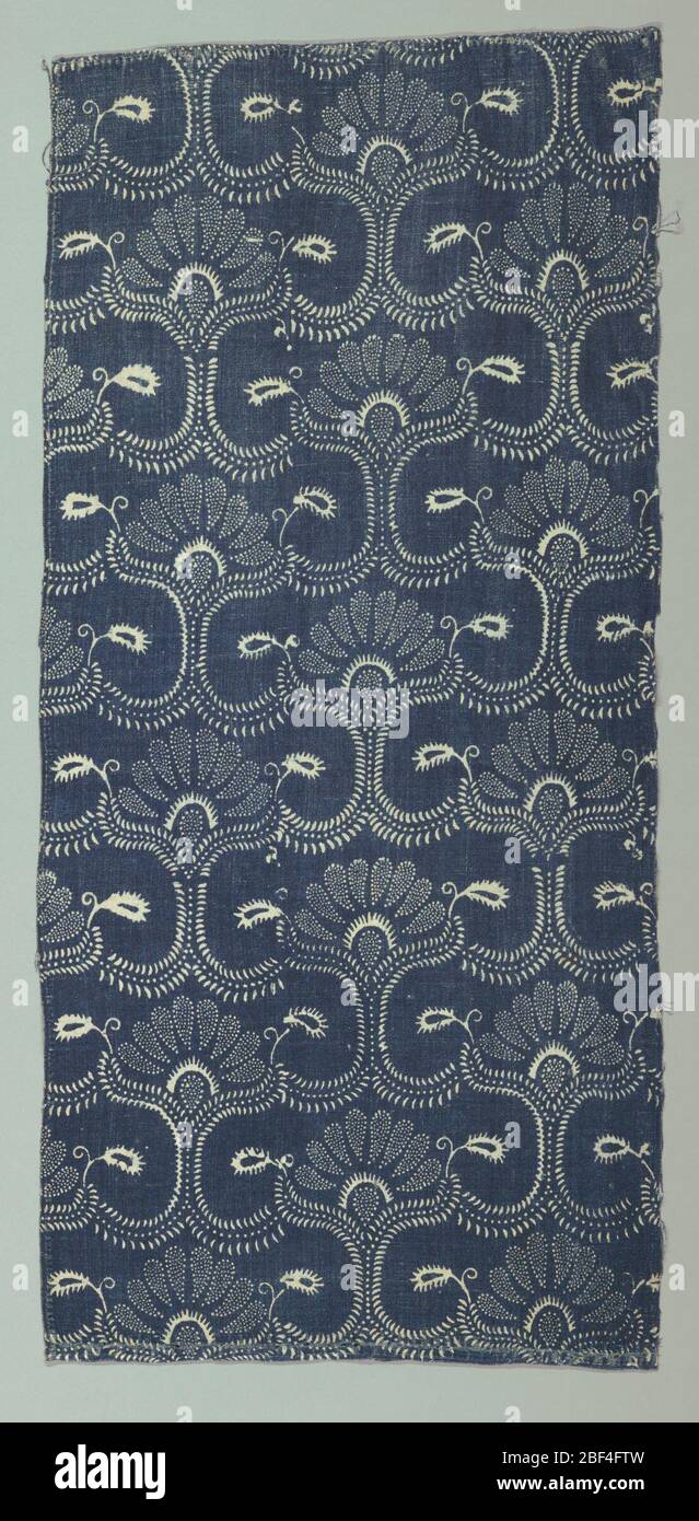 Textile. Textile with design of stylized floral scrolls, in white on a ...