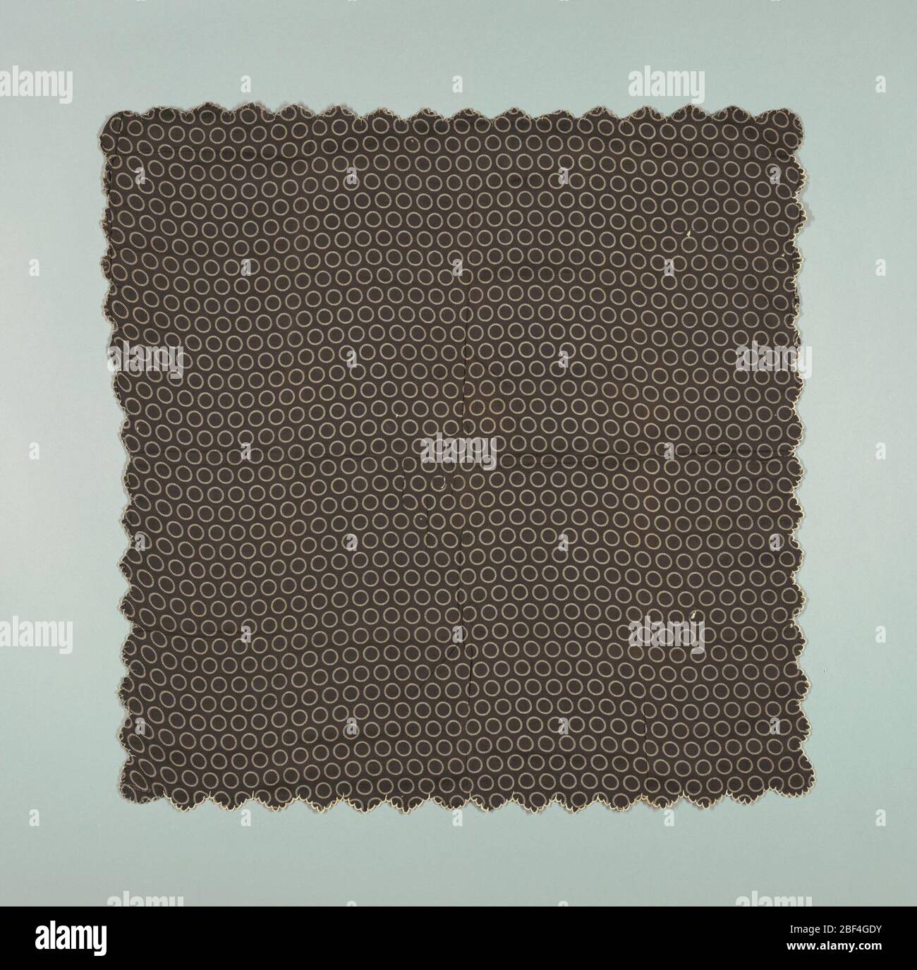 Textile. Square scalloped kerchief with a black ground and an allover ...