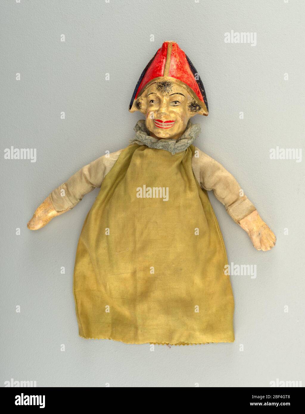 Puppet. Peaked hat, red and gold in front, blue behind. Green cotton ...