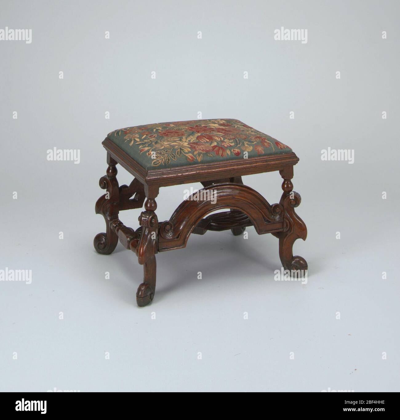 Foot stool. In William and Mary Style. Scroll legs and feet, carved ...