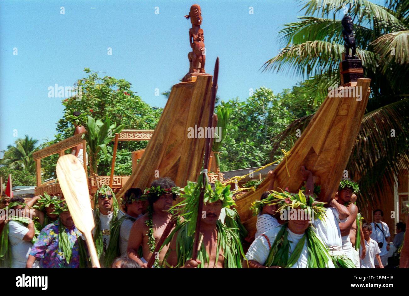 Cook Islanders celebrate the launching of a traditional twin-hulled ...