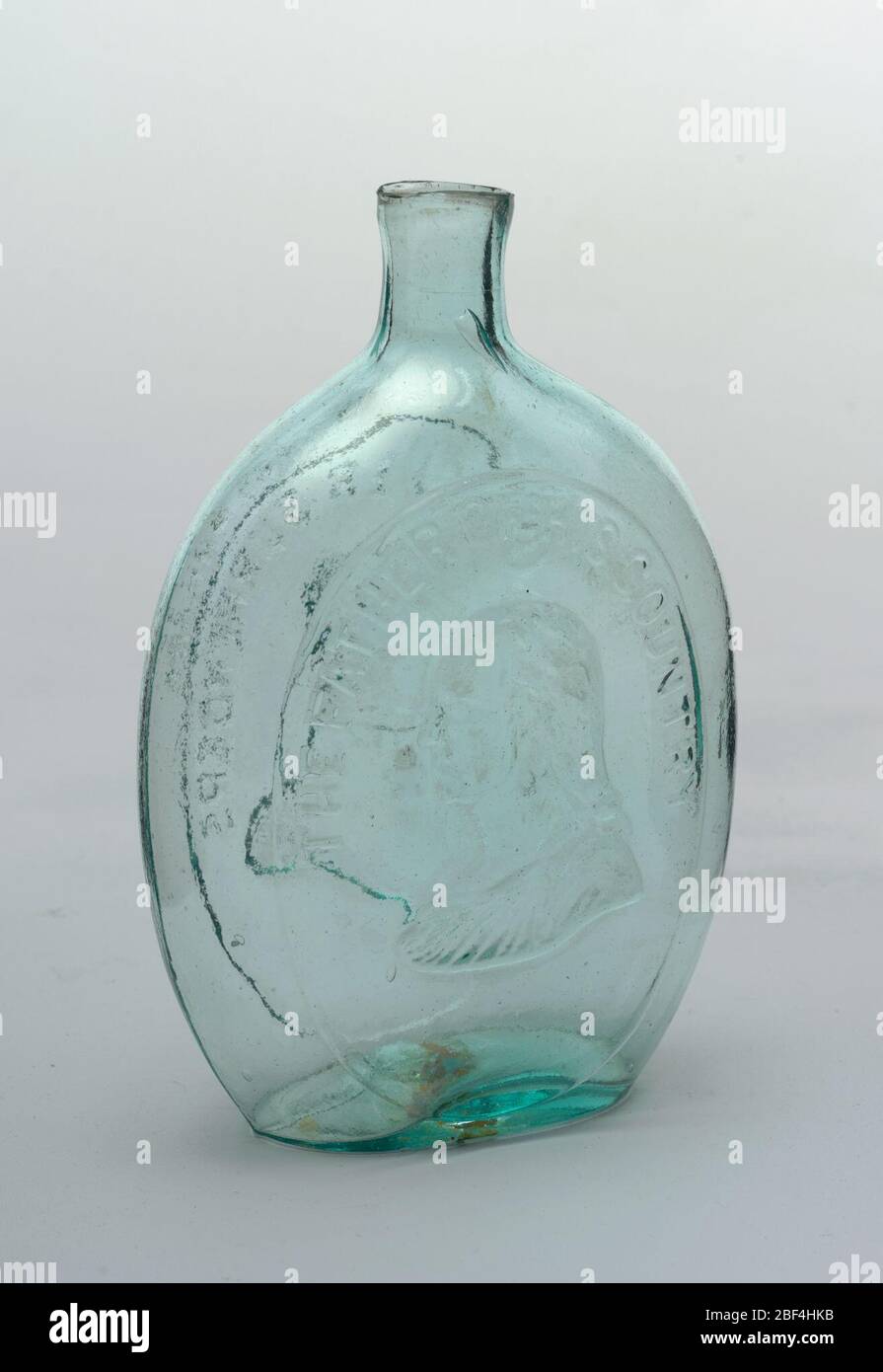 Flask. Bottle green glass. On one face, bust of Washington, with gueue ...