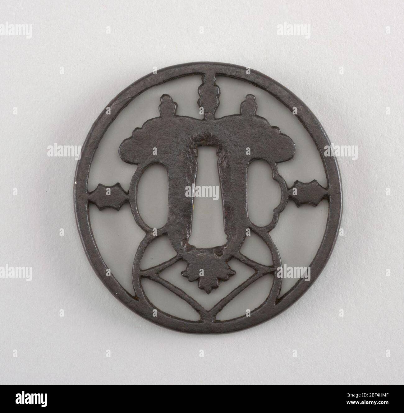 Tsuba. At the center is the nakago-ana, an opening through which the ...