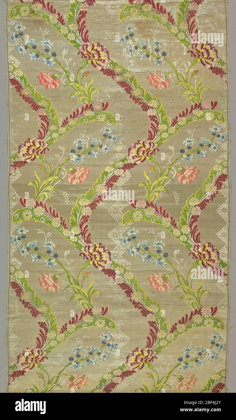 Textile. Scrolls of flowers in an allover design of carnations and ...