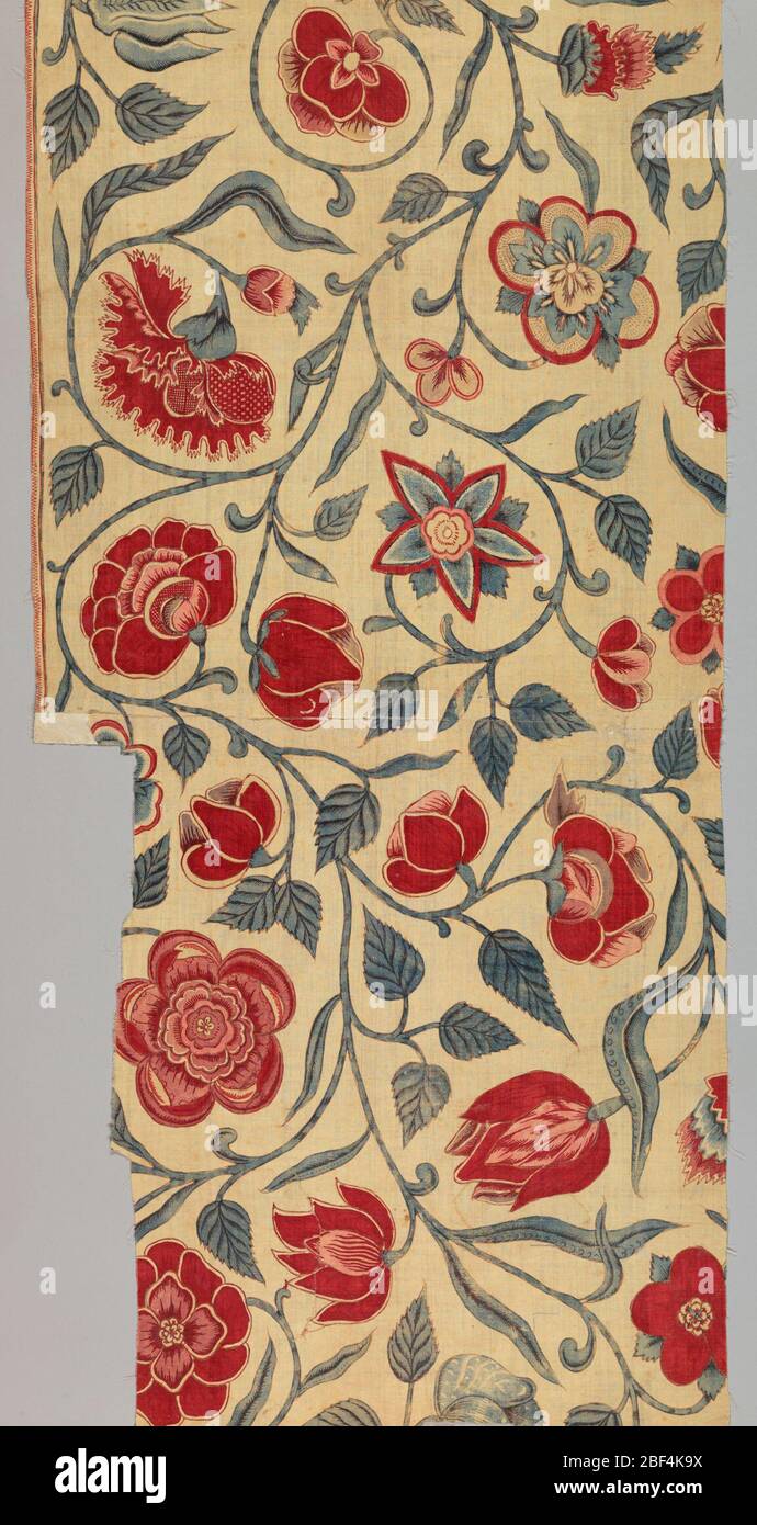 Textile. Scrolling vines with red and blue flowers, including tulips ...