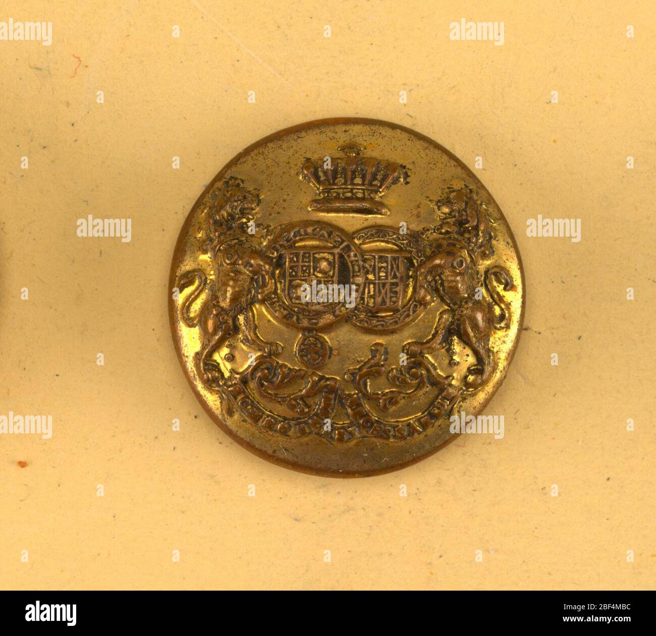 Button. Convex button showing coat of arms; two sheilds with heraldic ...