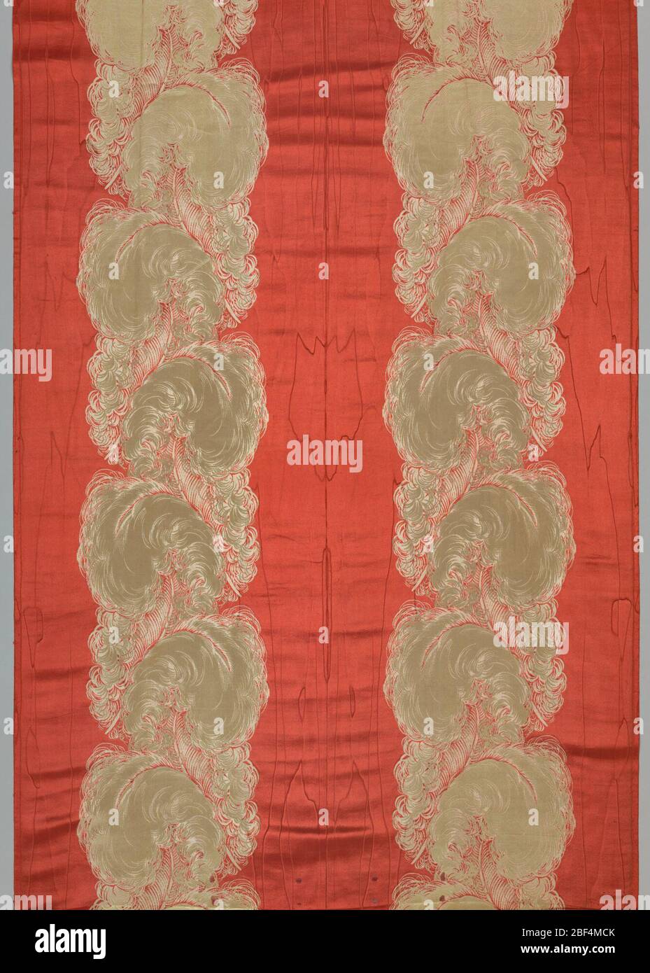 Textile. Orange-red ribbed silk moiré, with design of yellow plumes ...