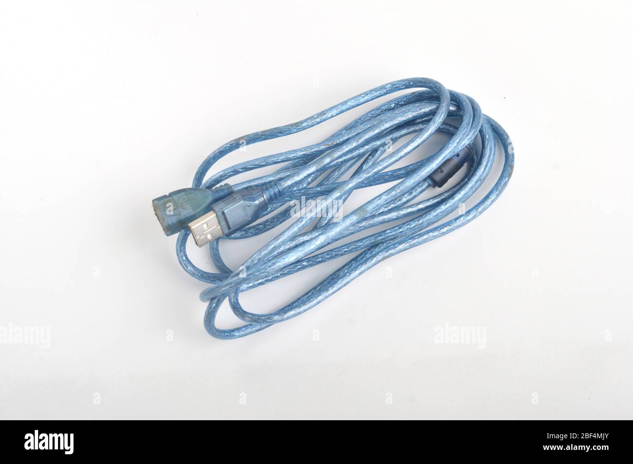 long blue usb cable on white background Stock Photo - Alamy