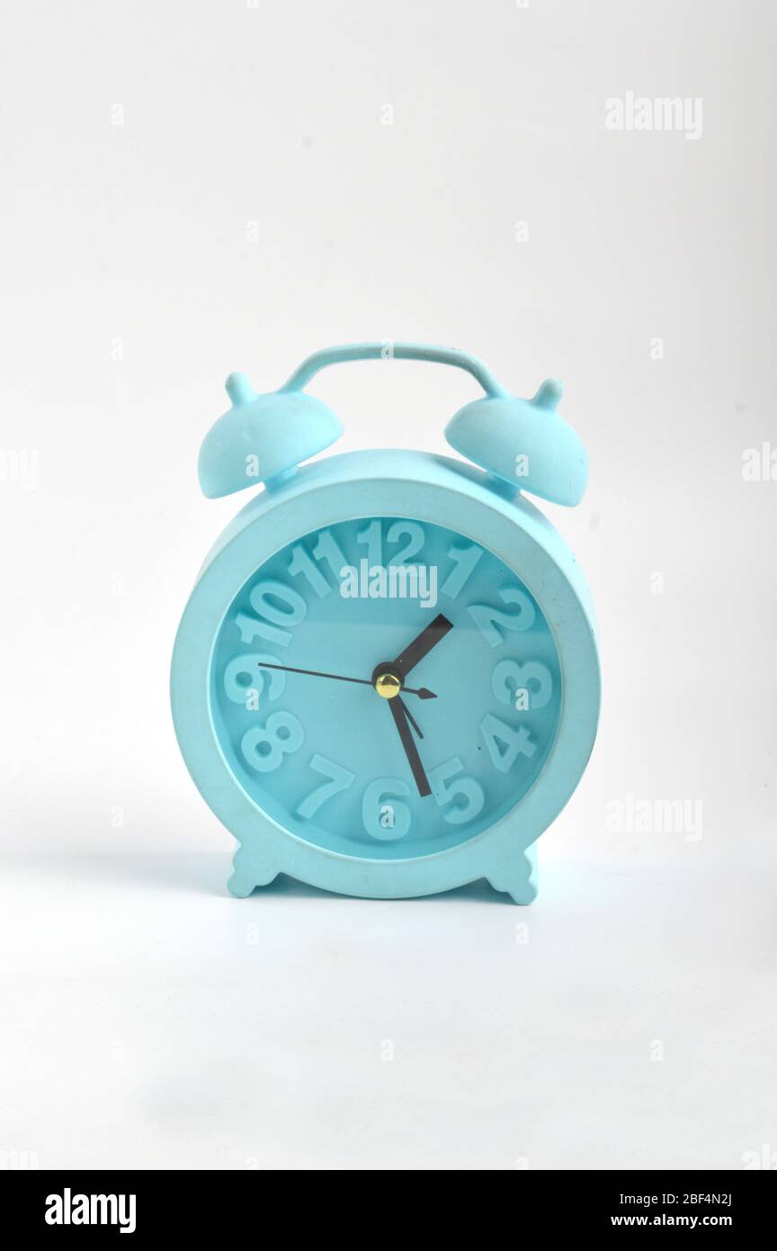 blue alarm clock isolated on white background Stock Photo - Alamy